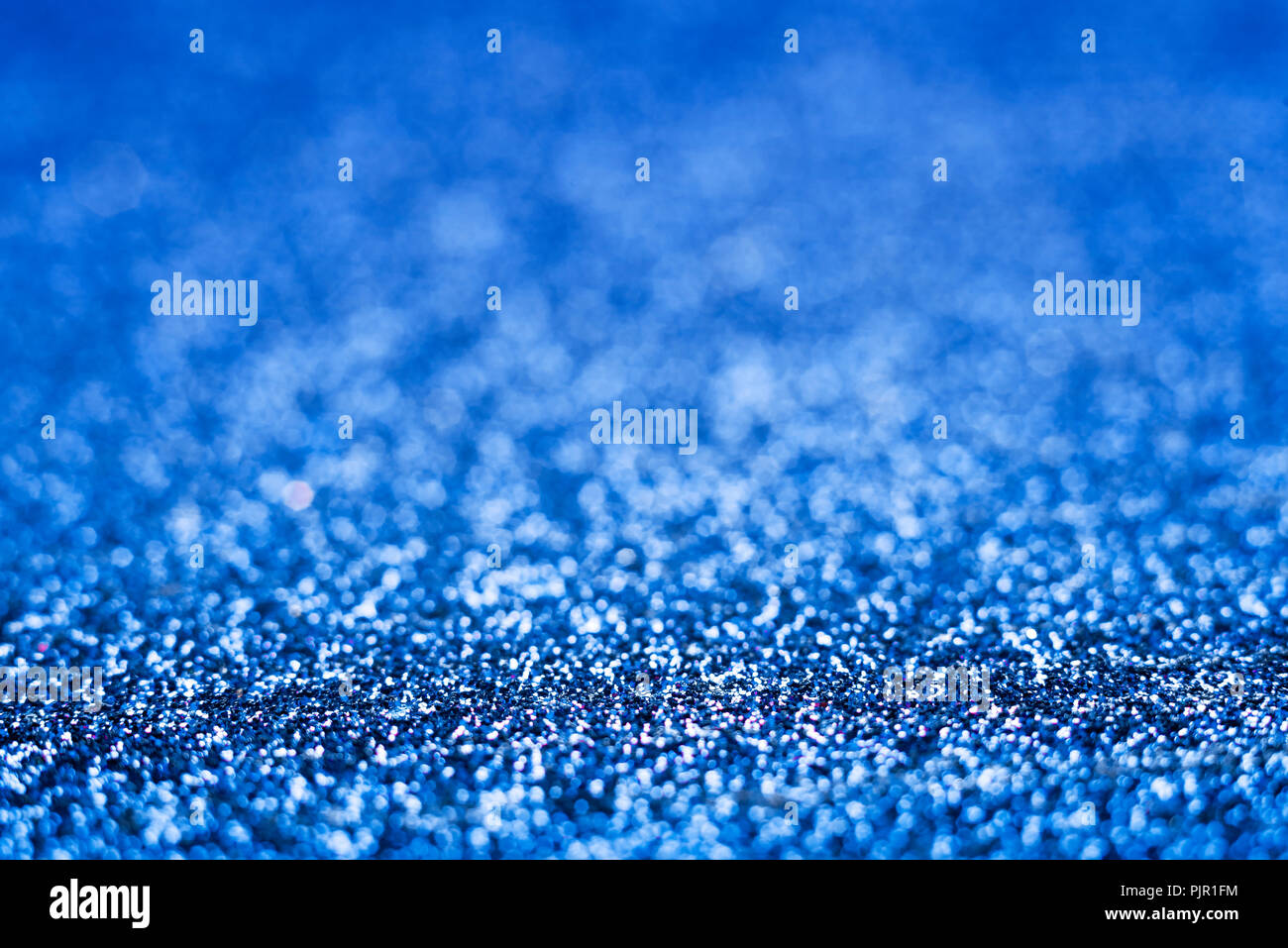 Shiny blue abstract christmas background. Blue glitter Stock Photo - Alamy