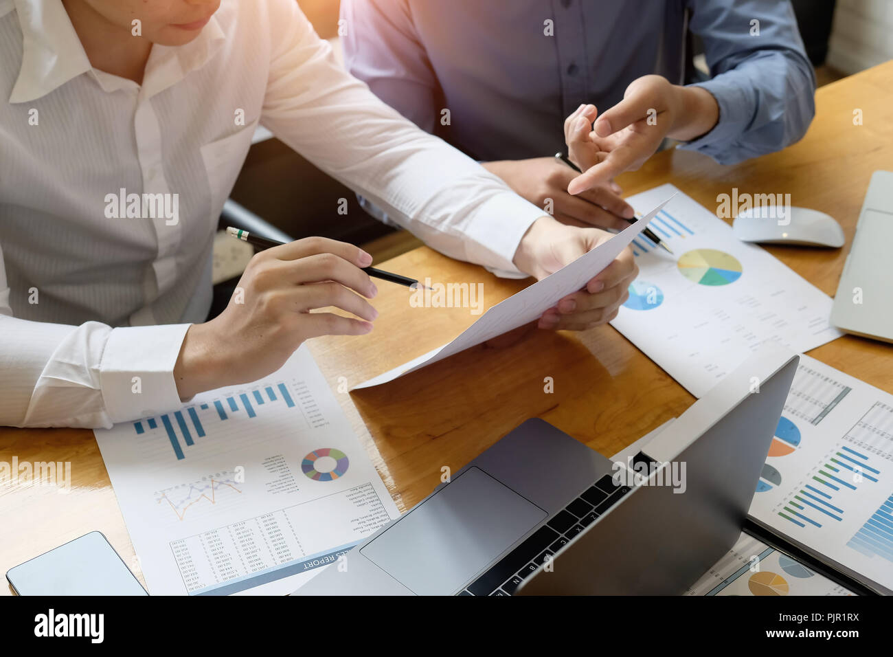 Business adviser meeting to analyze and discuss the situation on the ...