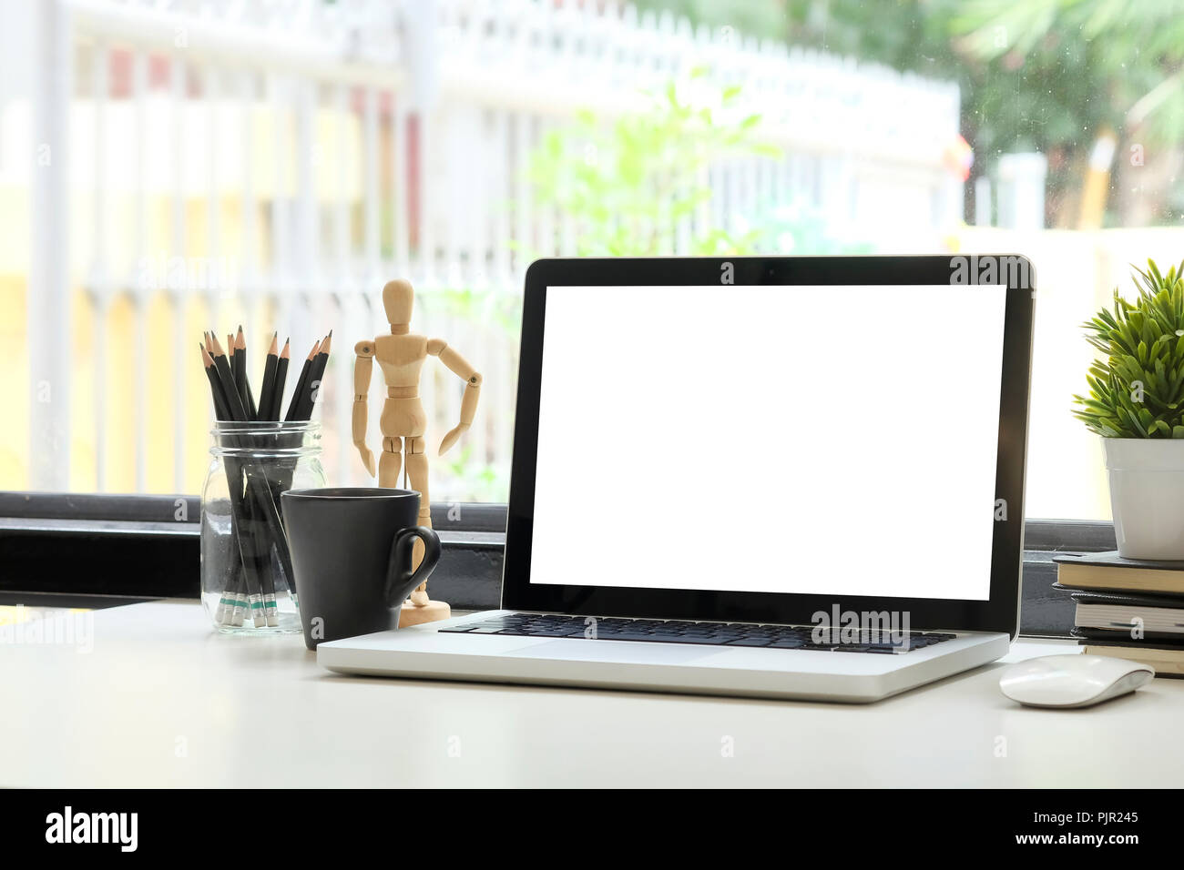 Workspace laptop computer, coffee, pencil and plant decoration with big ...
