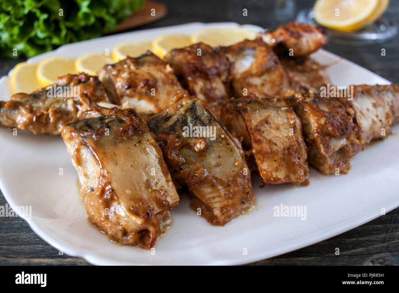 Marinated mackerel slices baked on the grill Stock Photo - Alamy