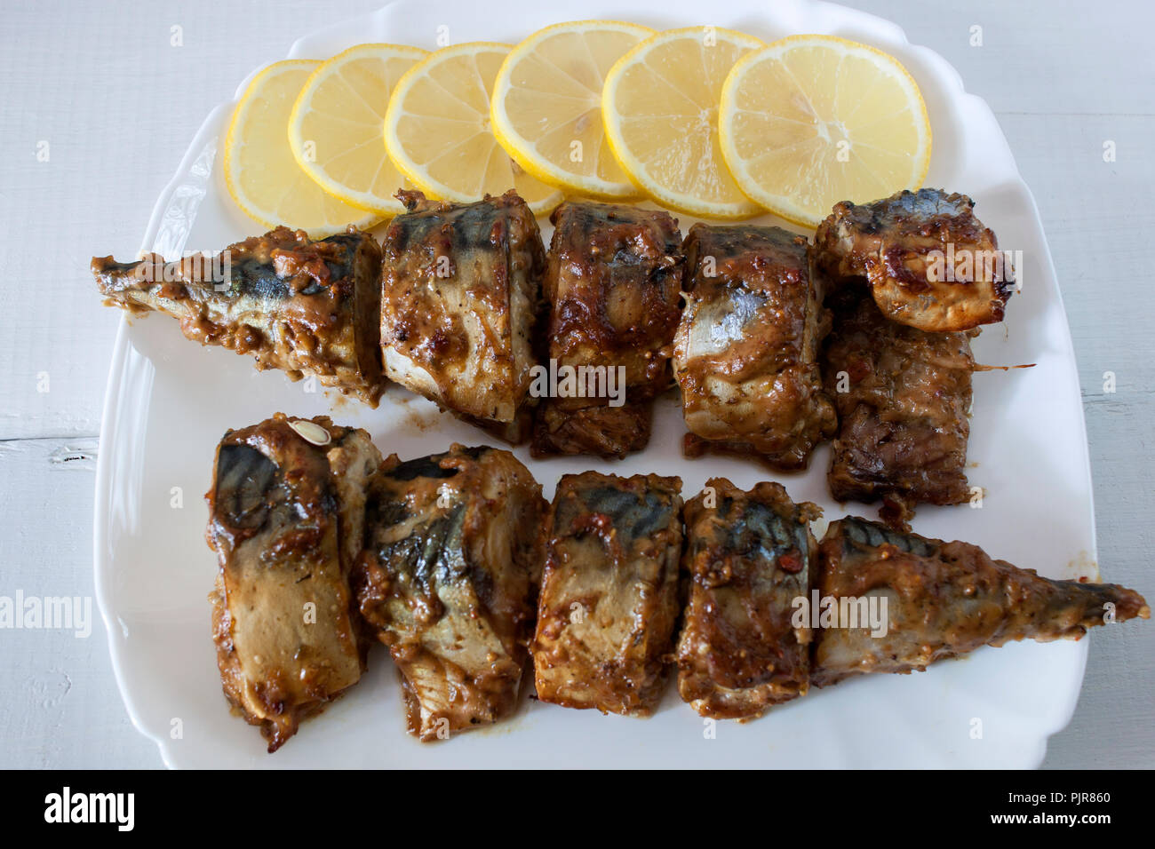 Marinated mackerel slices baked on the grill Stock Photo - Alamy
