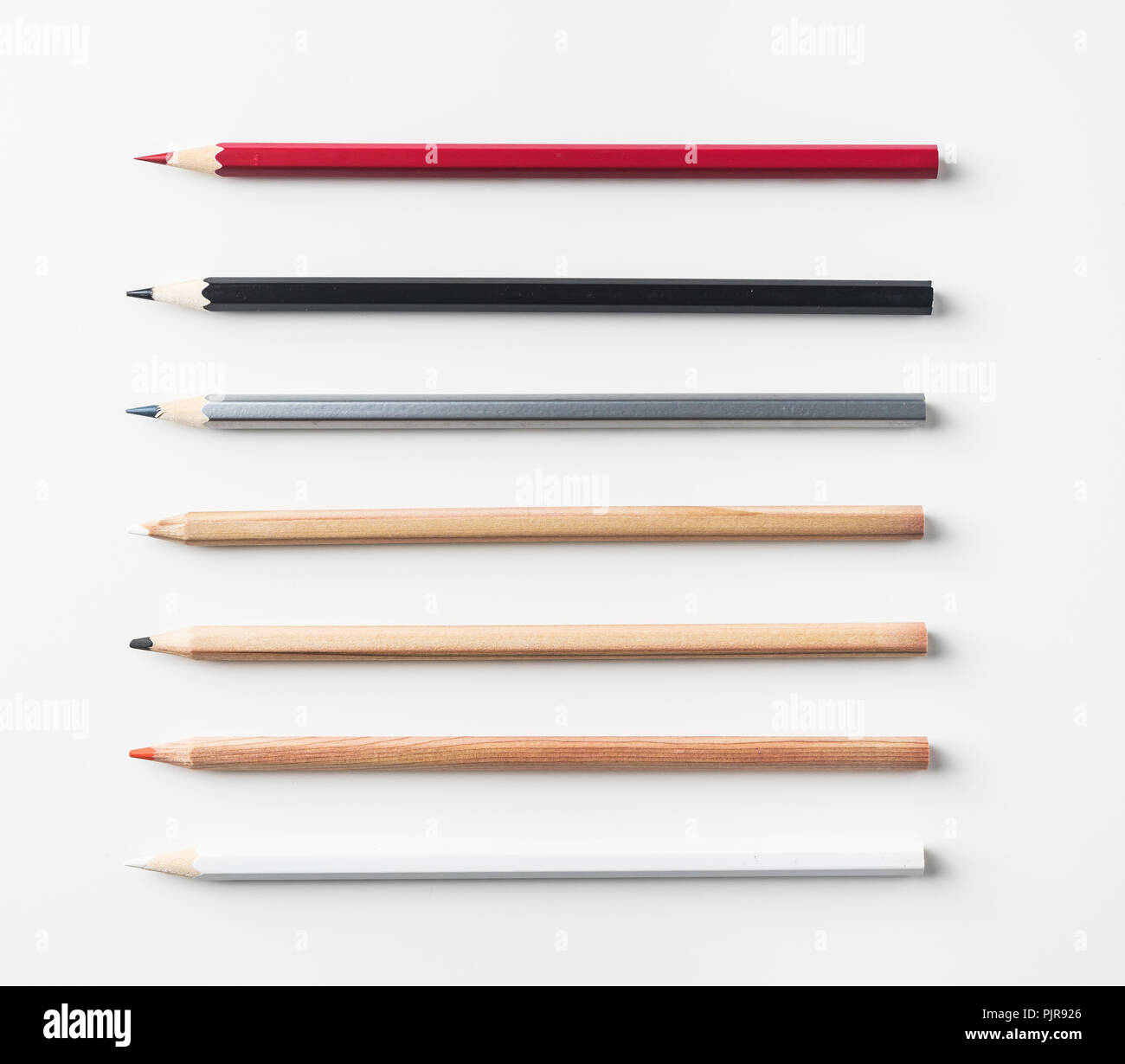 Top view of collection of pens on white background desk for mockup ...