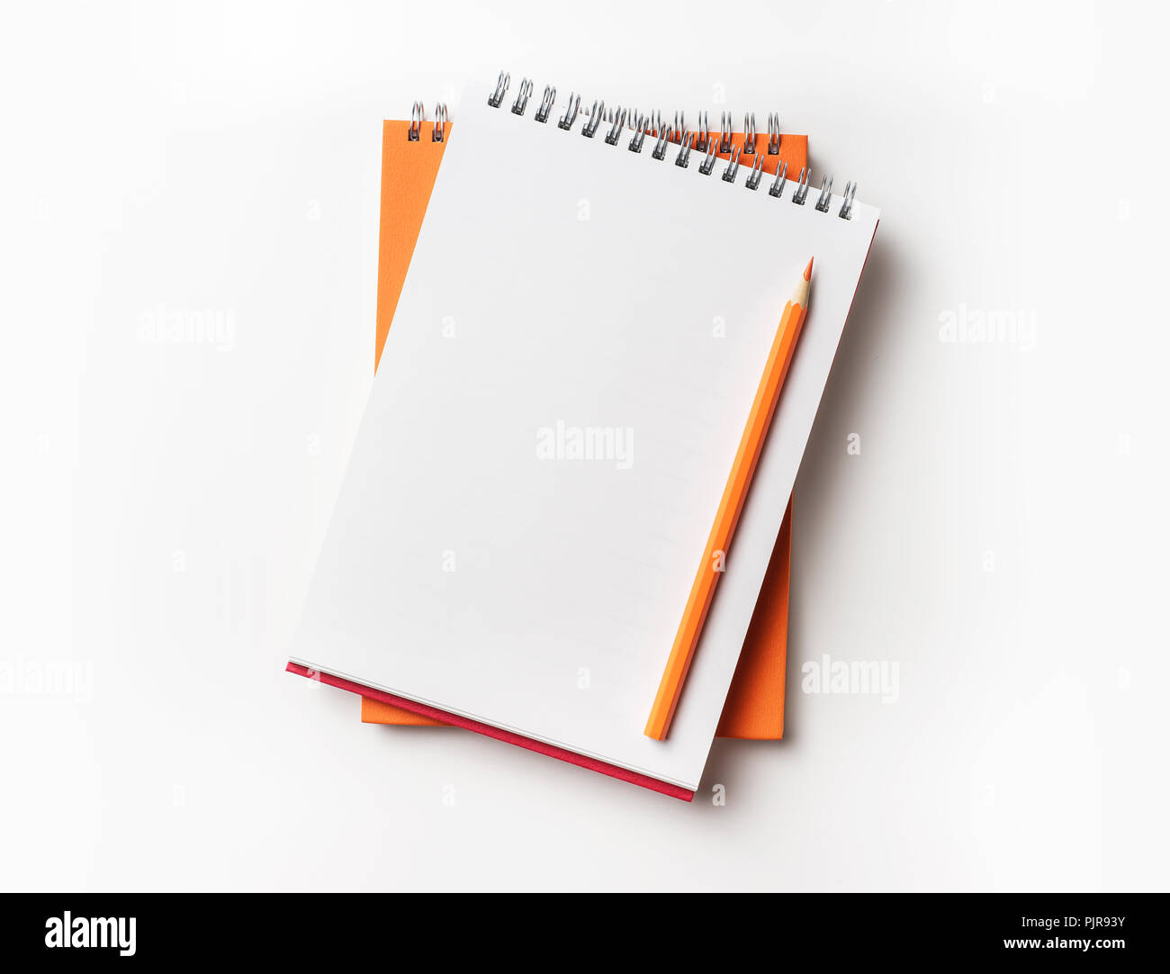 Design concept - Top view of orange and red spiral notebook and color ...