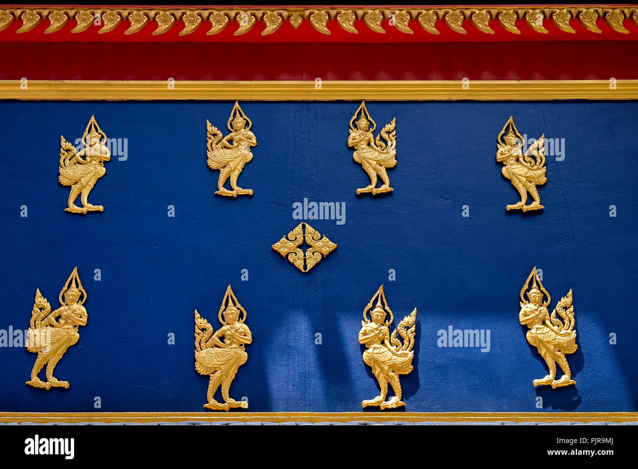 Kinnari. Thailand Temple wall art featuring Kinnaree golden figures ...