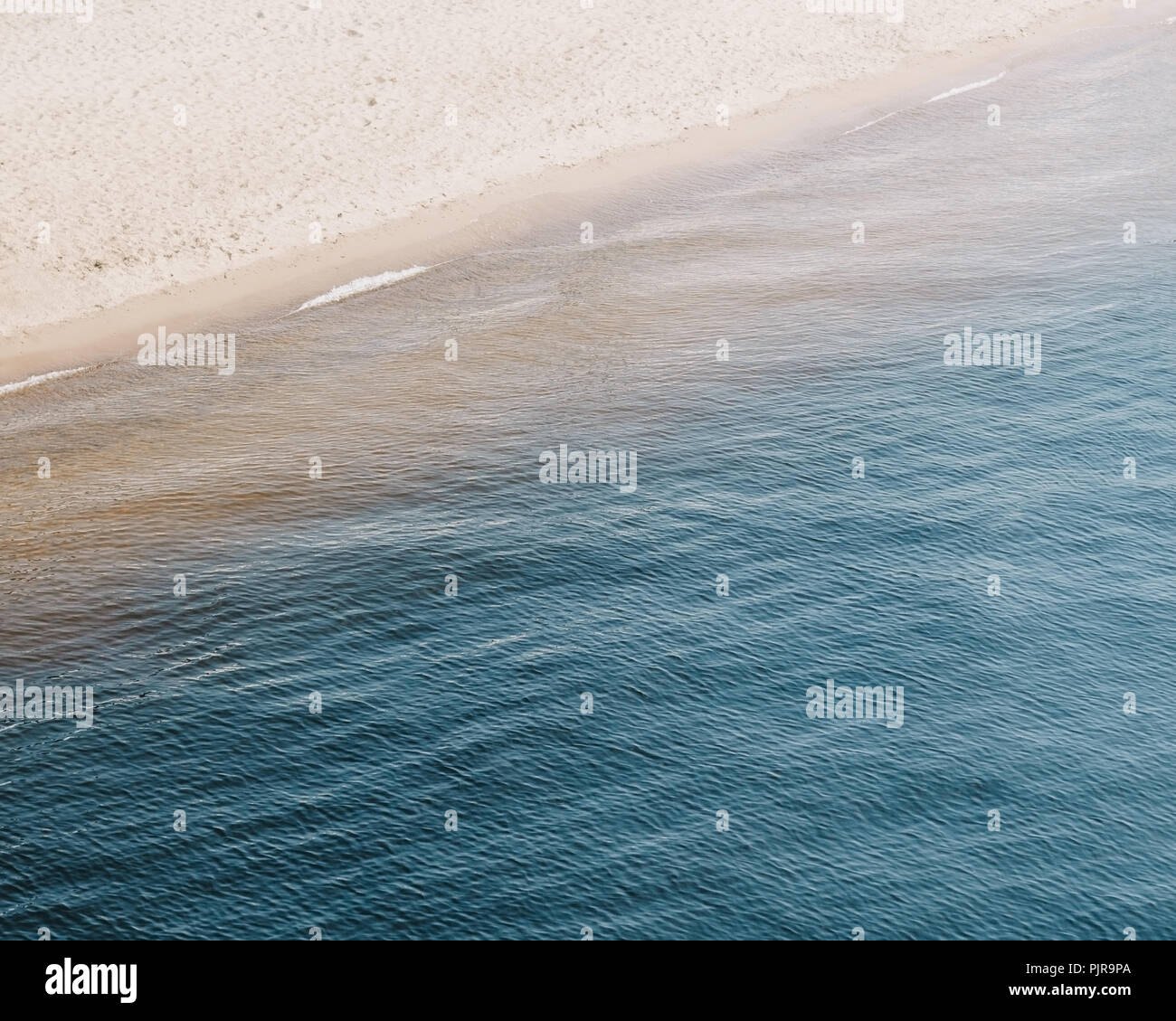 The beautiful calm view of blue sea and coastline Stock Photo - Alamy