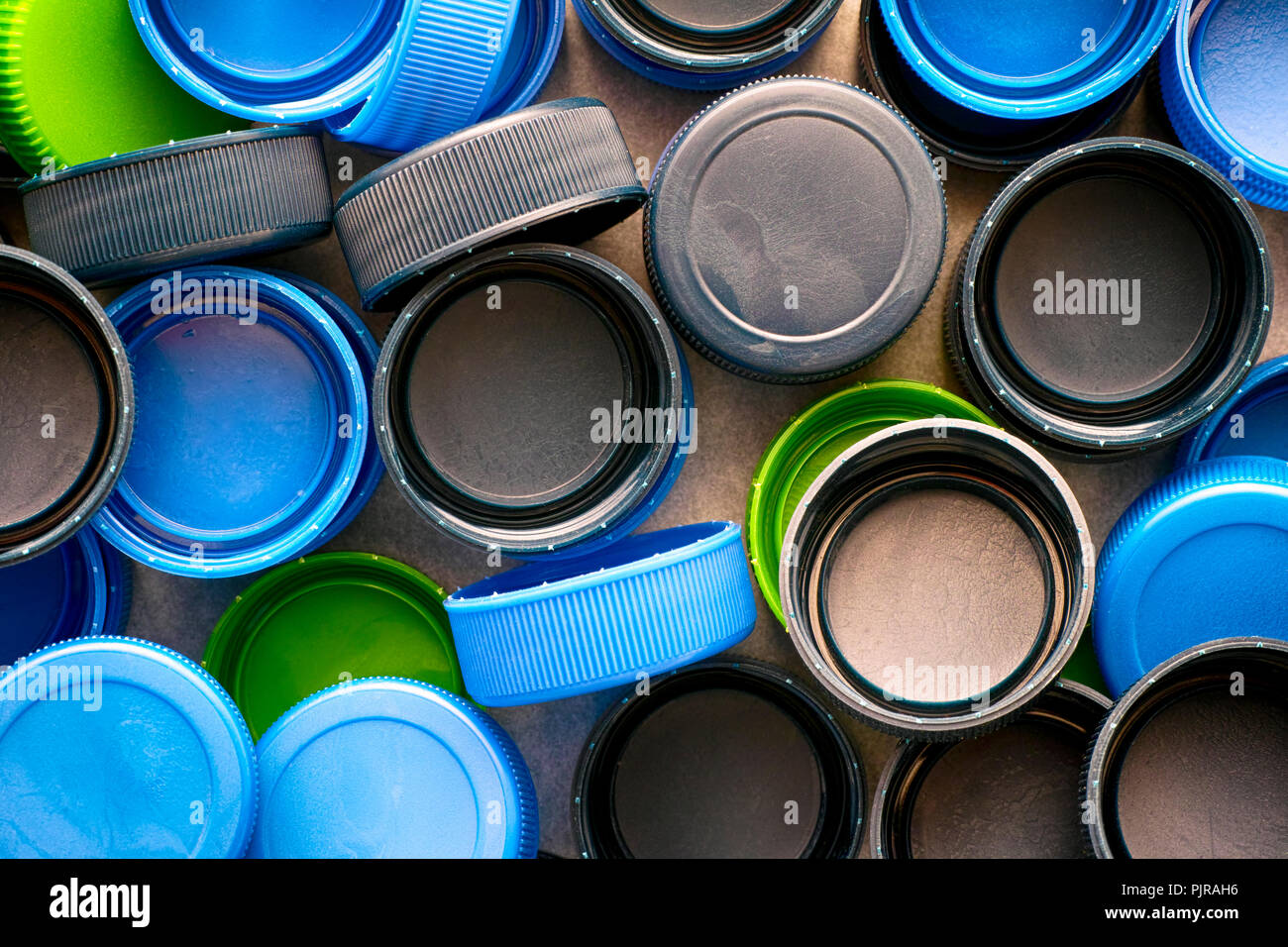 Plastic caps on black backgrounds. Close-up Stock Photo - Alamy