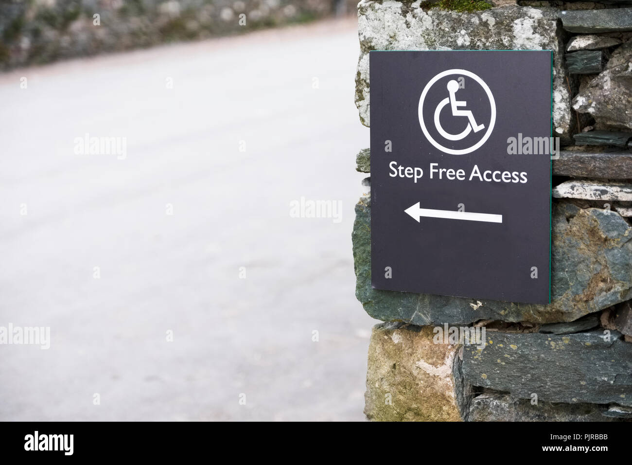 Disabled wheelchair sign with icon and arrow hi-res stock photography ...