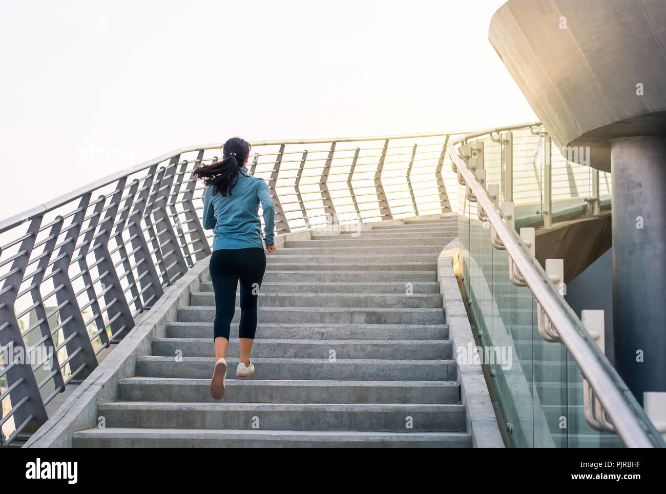 Girl running on the staircase, outdoors workout concept Stock Photo - Alamy