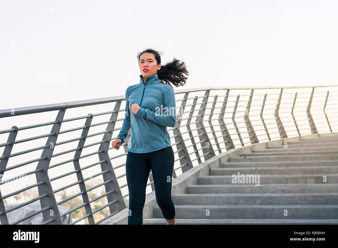 Girl running on the staircase, outdoors workout concept Stock Photo - Alamy
