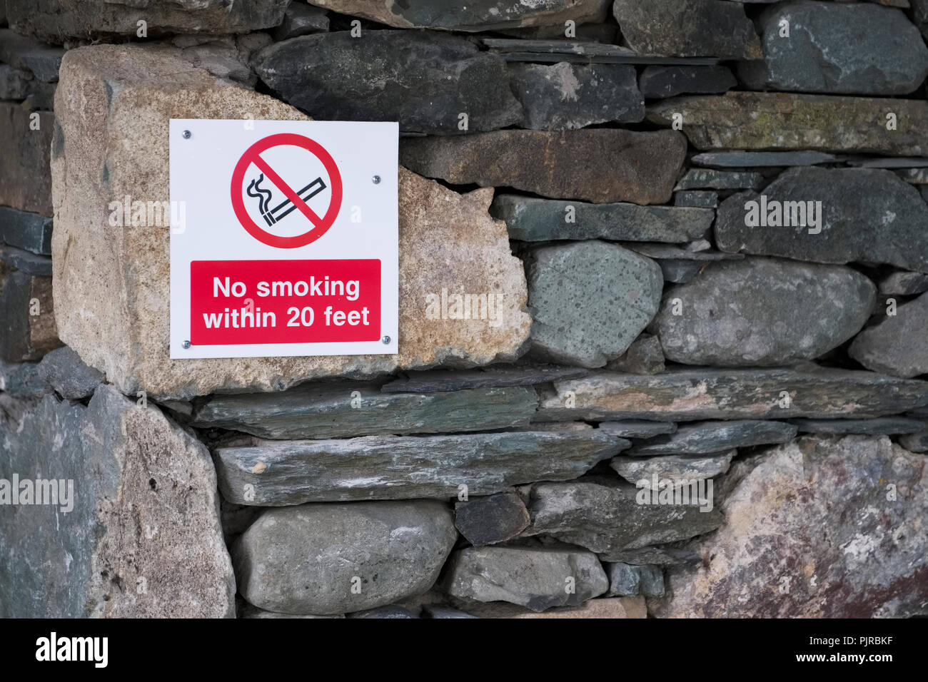 No smoking within 20m feet sign on wall in public area outdoors Stock ...