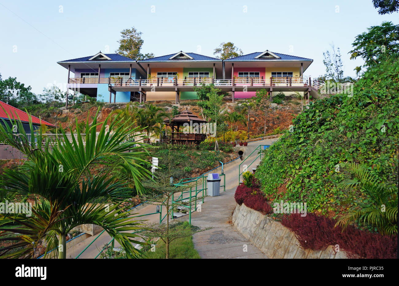 Colored one-story hotel on top of a hill. Thailand Stock Photo - Alamy