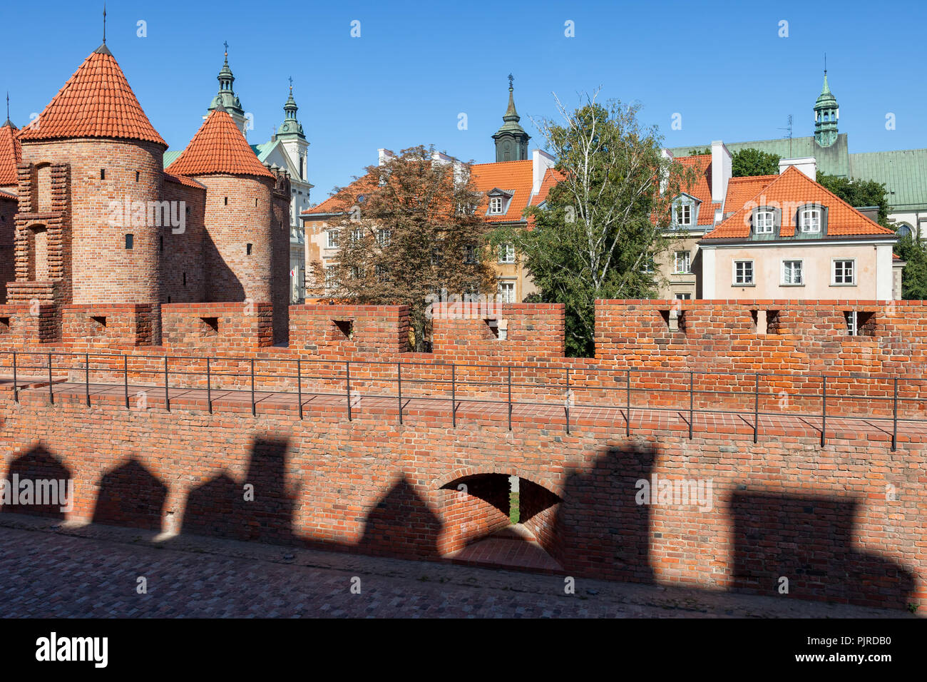 City of Warsaw in Poland, Old Town brick wall fortification, houses in ...
