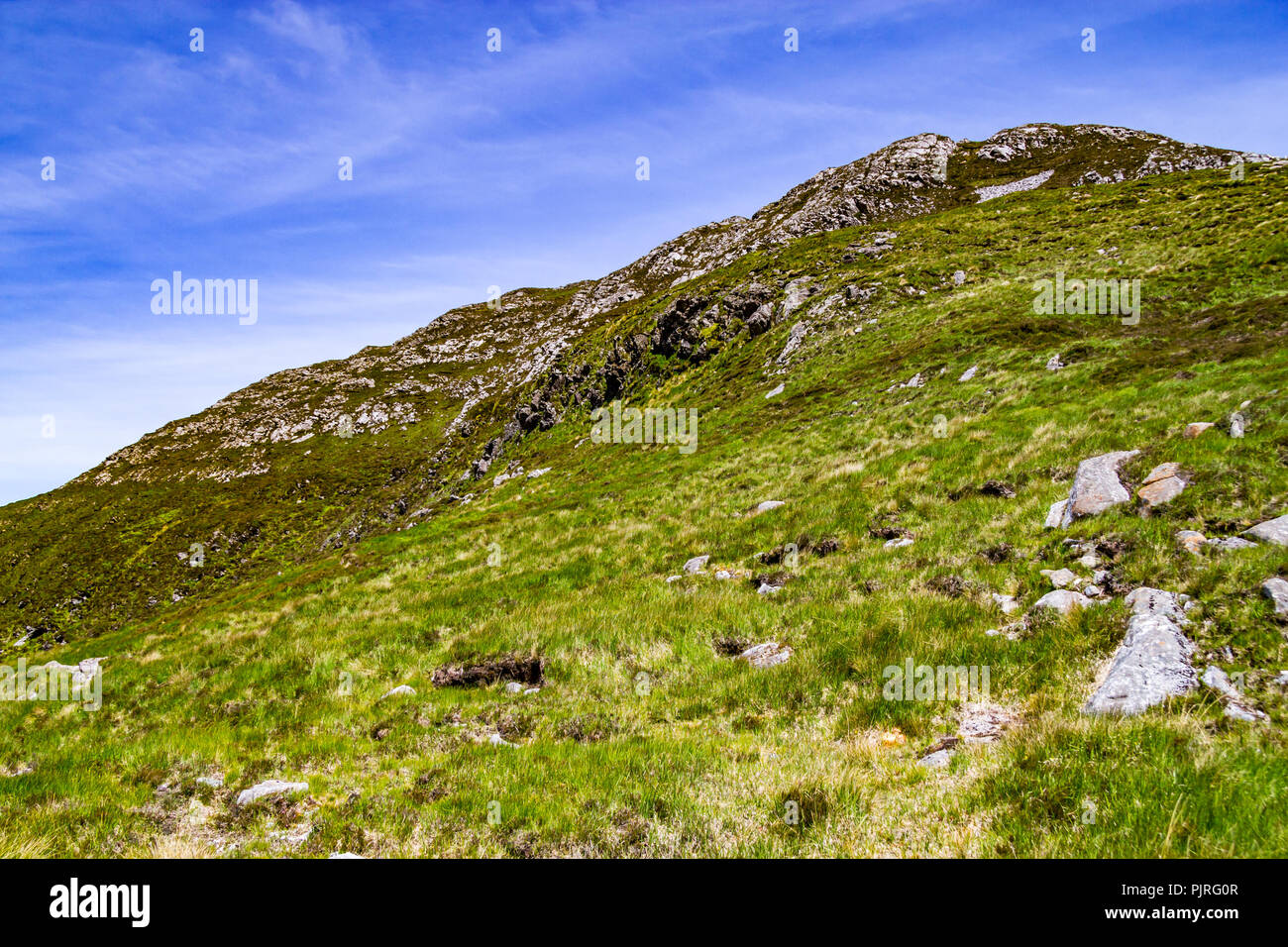 Diamond hill with rocks and blue sky in Letterfrack, Ireland Stock ...