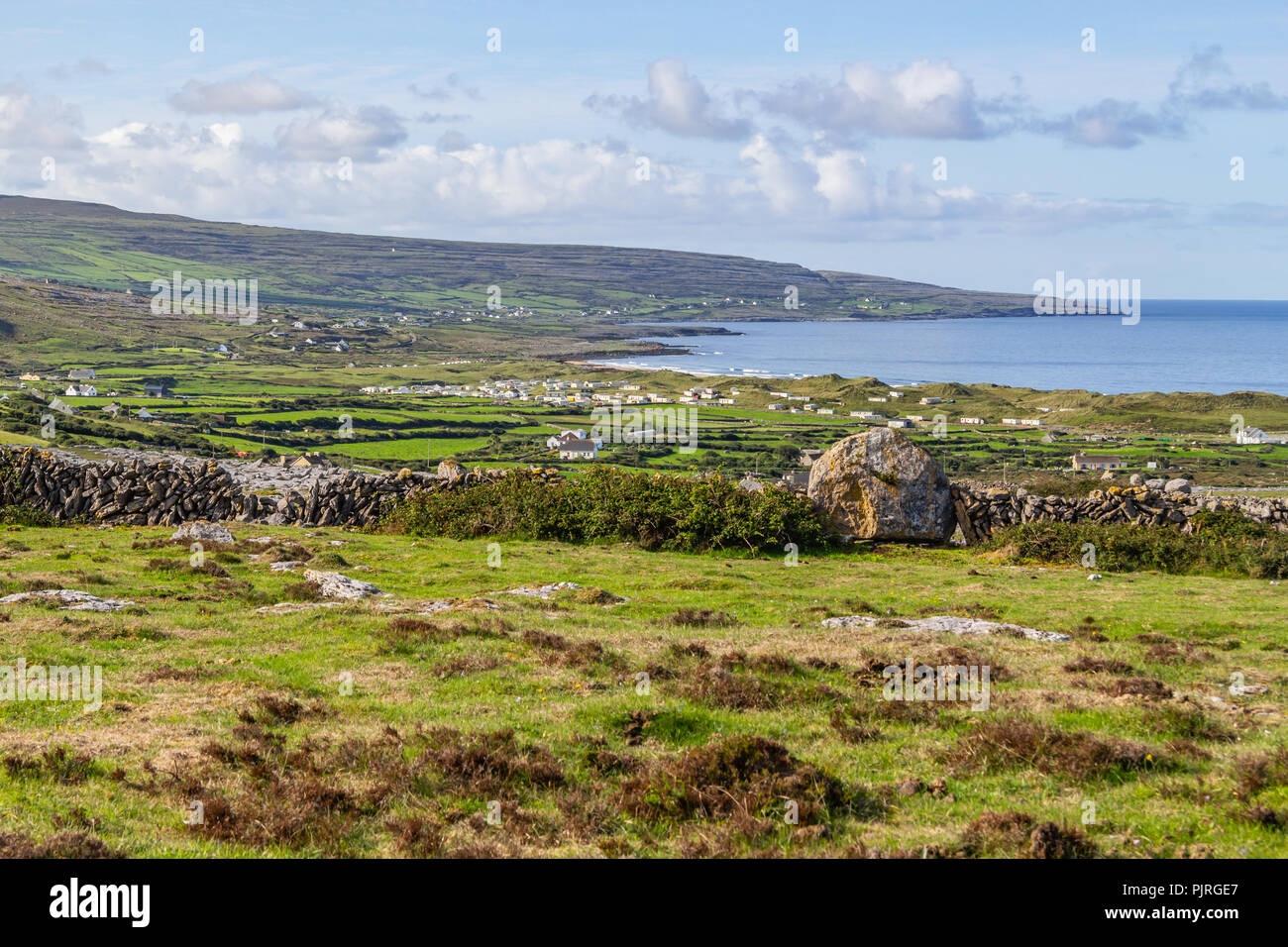 Farm field and stone wall with Farms and houses in the Fanore village ...