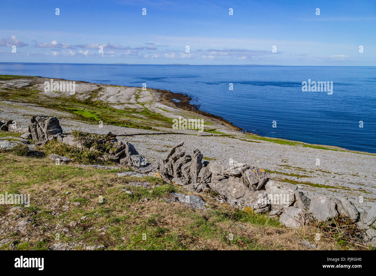 Fanore beach in Burren mountain with Aran Islands in background, Fanore ...