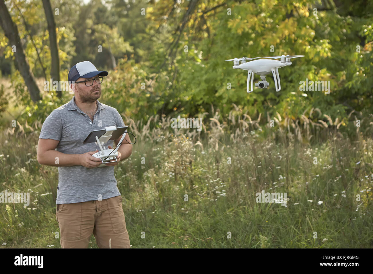 Man manages quadrocopters. Remote control for the drone in the hands of ...