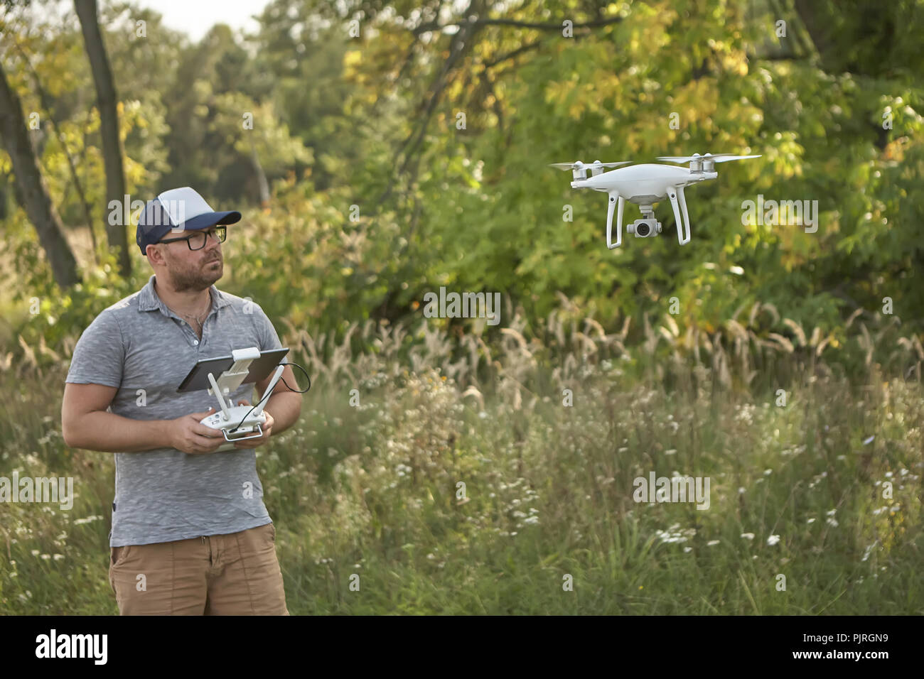 Man manages quadrocopters. Remote control for the drone in the hands of ...