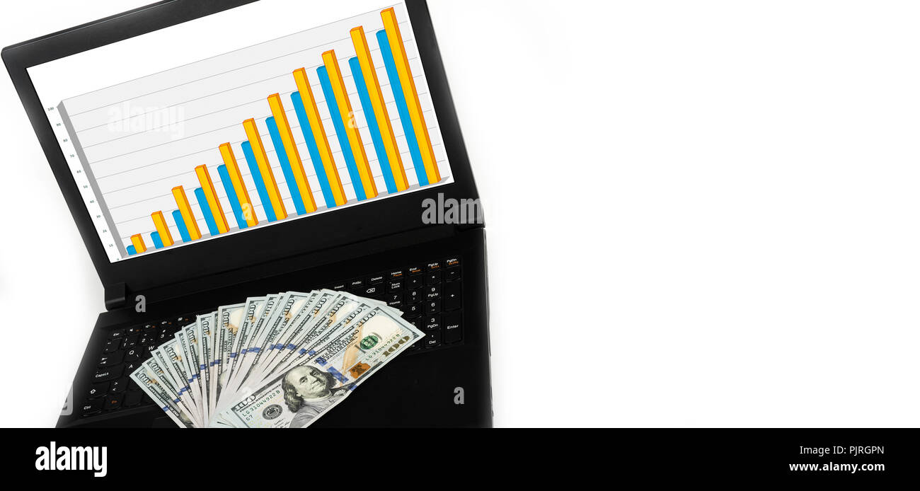 Laptop or notebook with widespread of cash money isolated on white ...