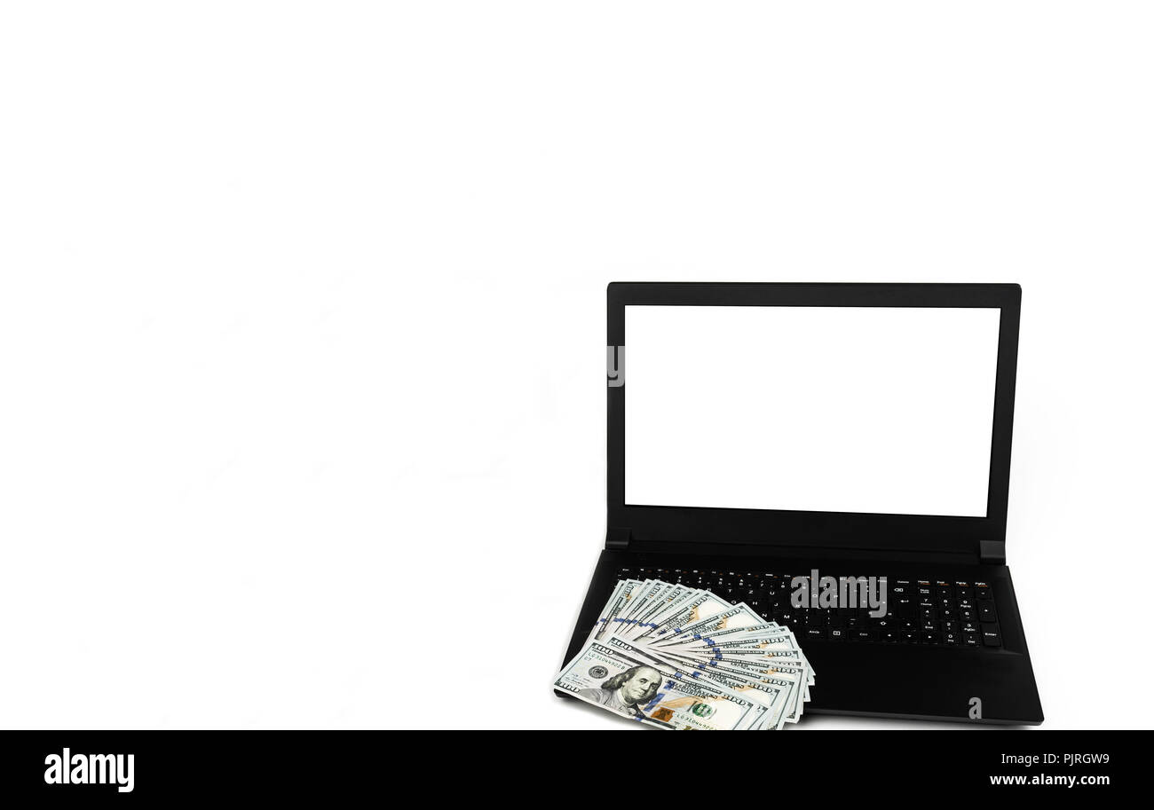 Laptop or notebook with widespread of dollar cash money isolated on ...