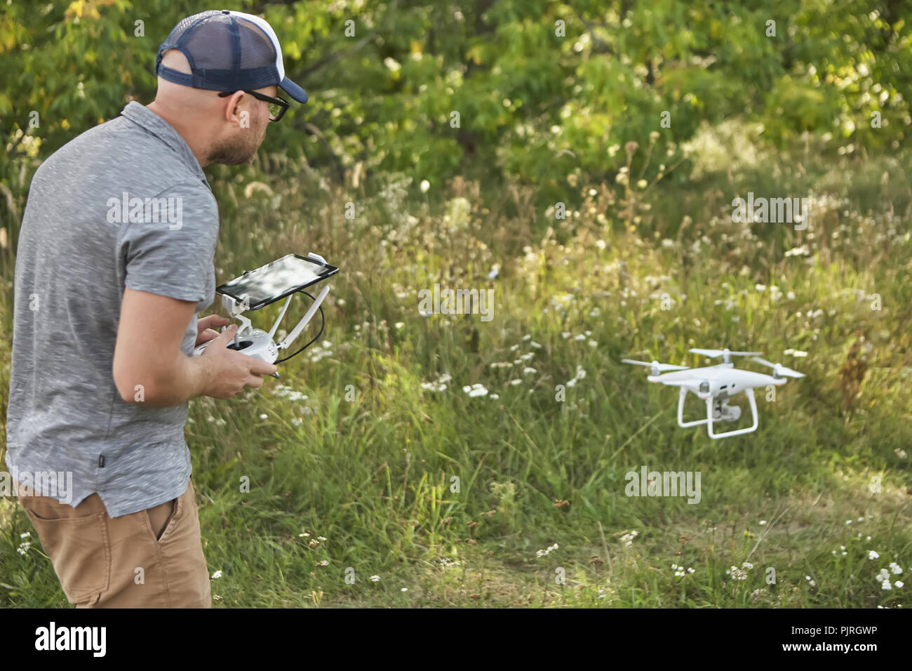Man Manages Quadrocopters Remote Control For The Drone In The Hands Of