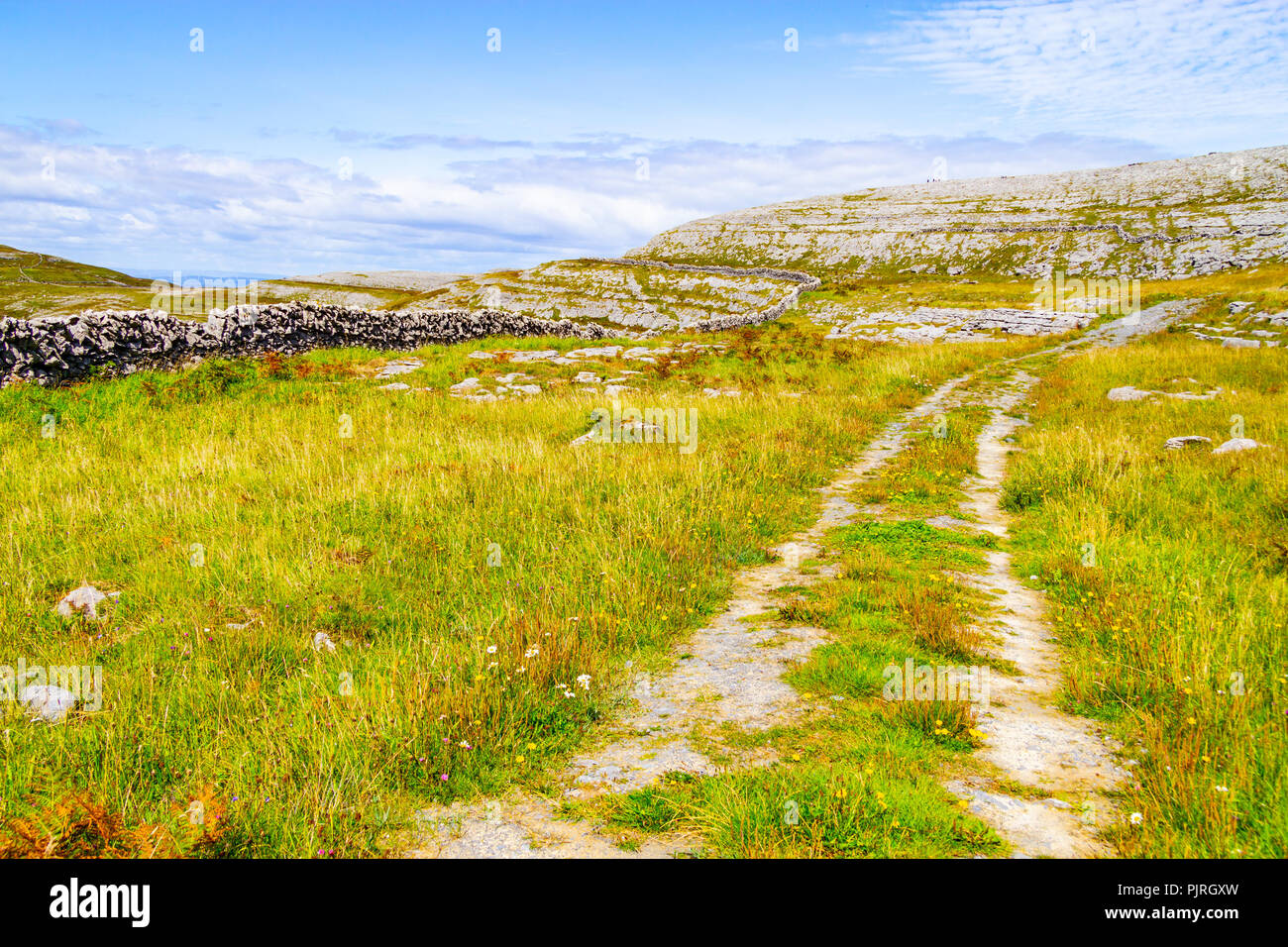 Rocks and trail over mountain in Burren way trail, Ballyvaughan, Clare ...