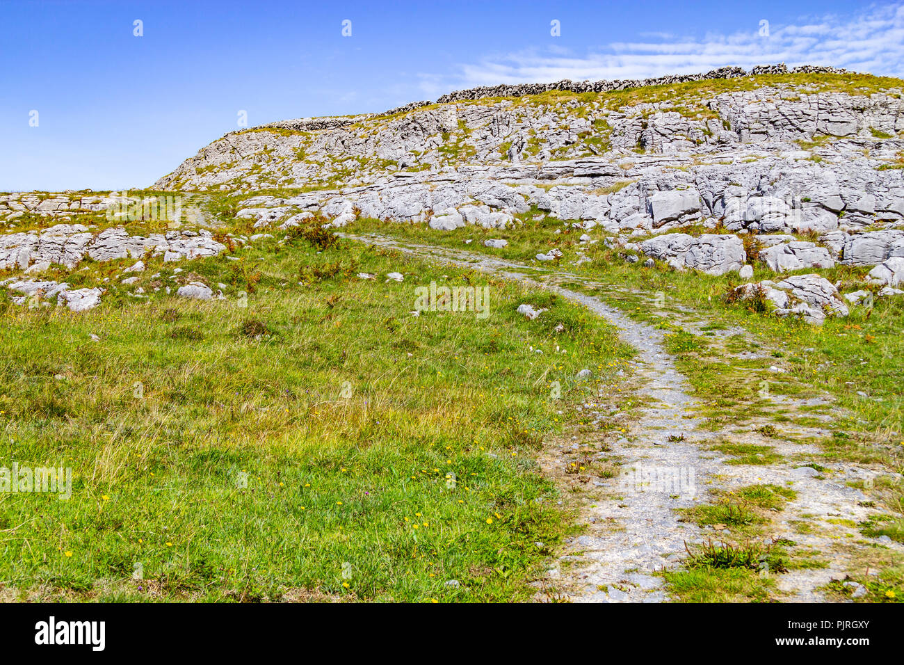 Rocks and trail over mountain in Burren way trail, Ballyvaughan, Clare ...