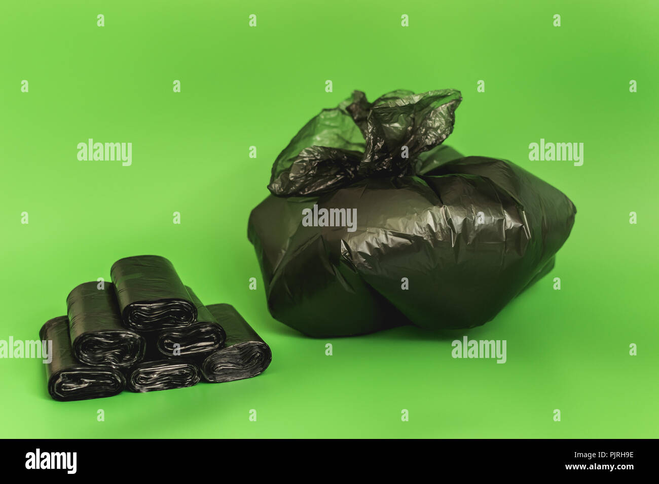 stacked black bags and bagged trash. take out the garbage Stock Photo ...