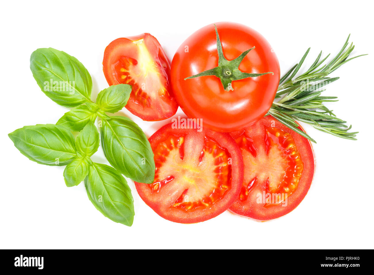 Tomatoes tomatos vegetables with basil from above isolated on a white ...