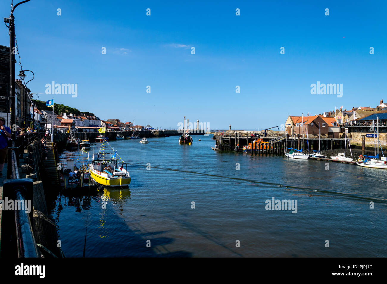 A view of Whitby Harbour and the River Esk on a summer's day Stock ...