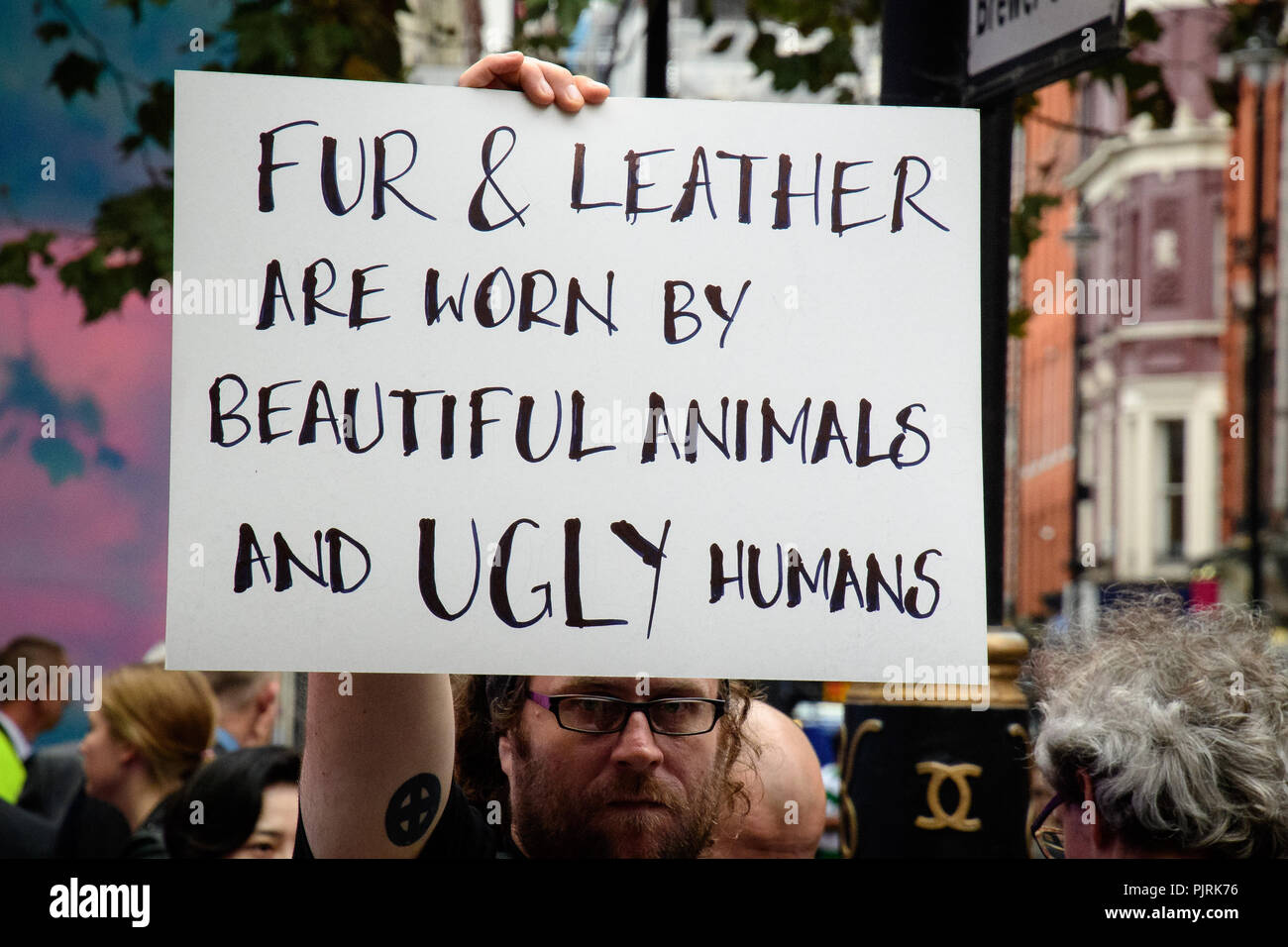 Animal cruelty protesters hold signs as they target London Fashion Week ...
