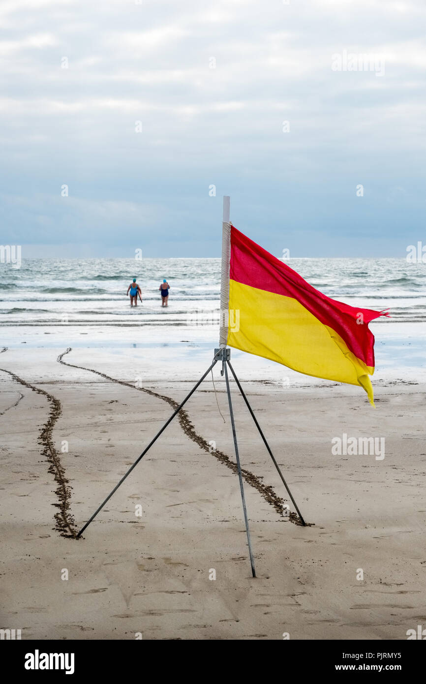 Lifeguard safe bathing flag with bathers, Whitesands beach ...