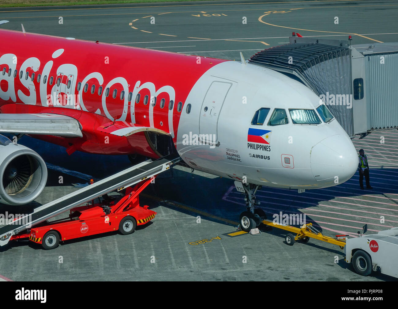 Manila, Philippines - Dec 21, 2015. Passenger airplane docking at NAIA ...