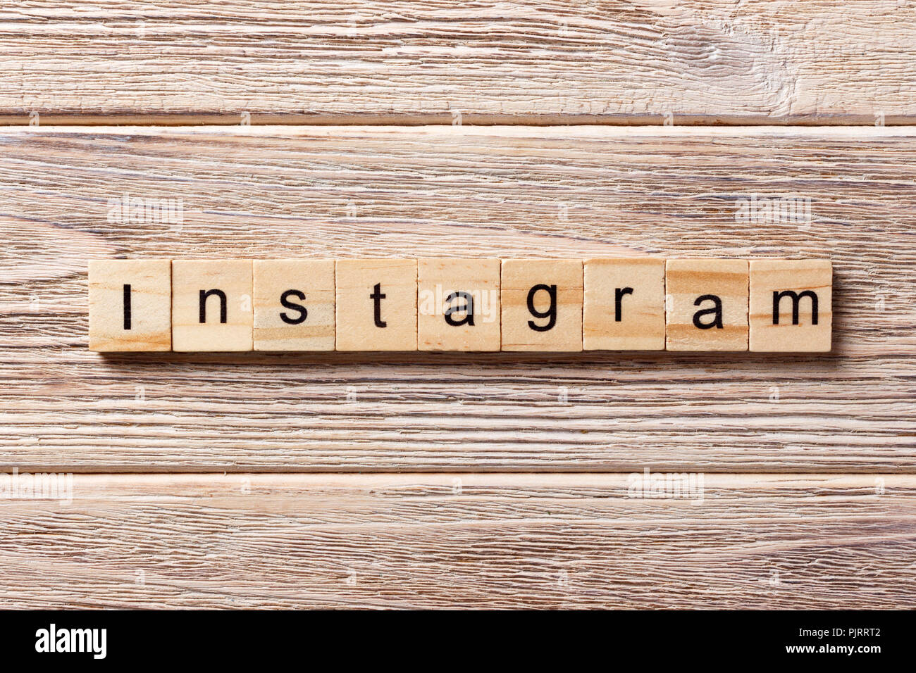 Instagram word written on wood block. Instagram text on table, concept ...