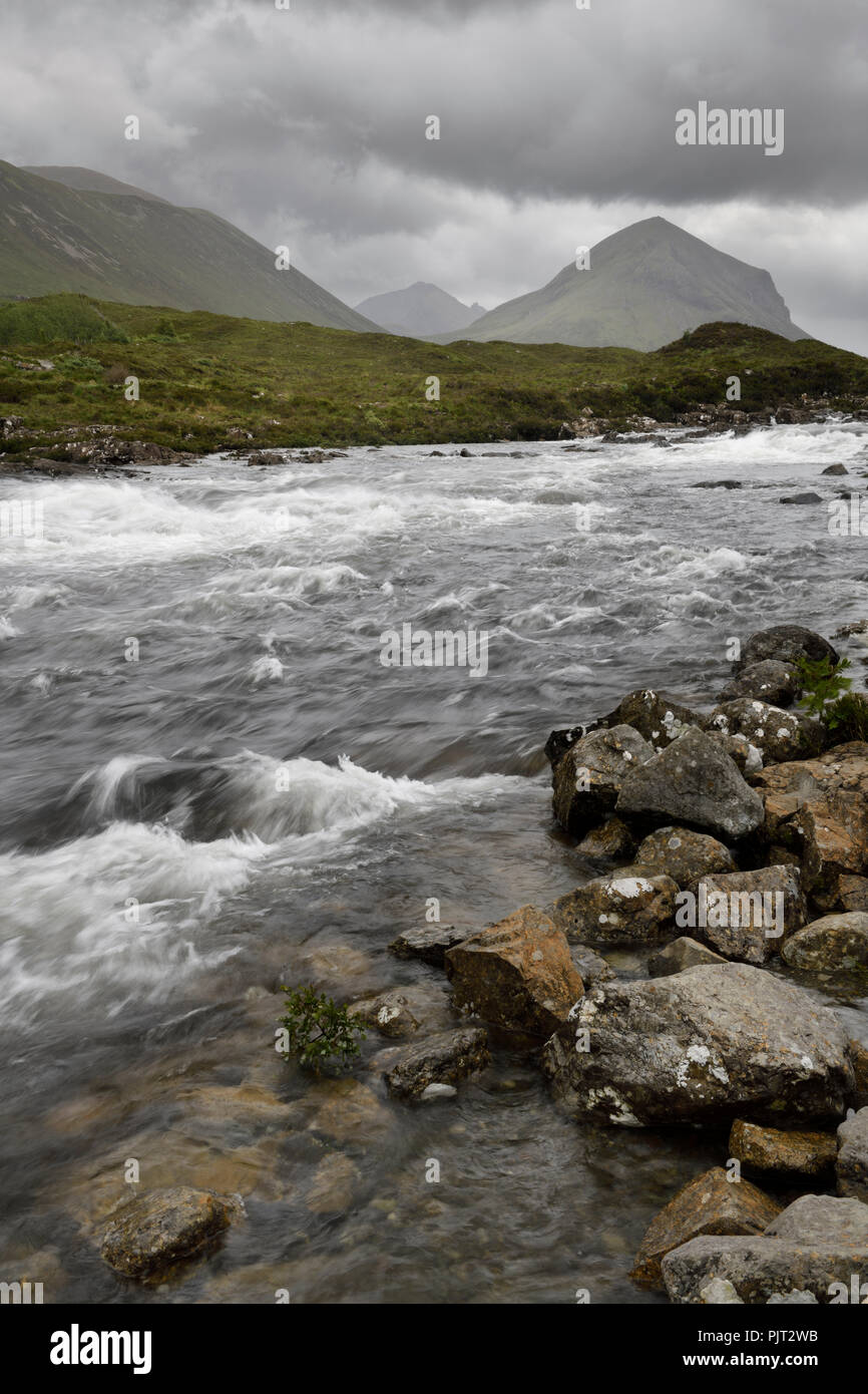 River Sligachan rapids after a storm with Marsco peak of Red Cuillin ...