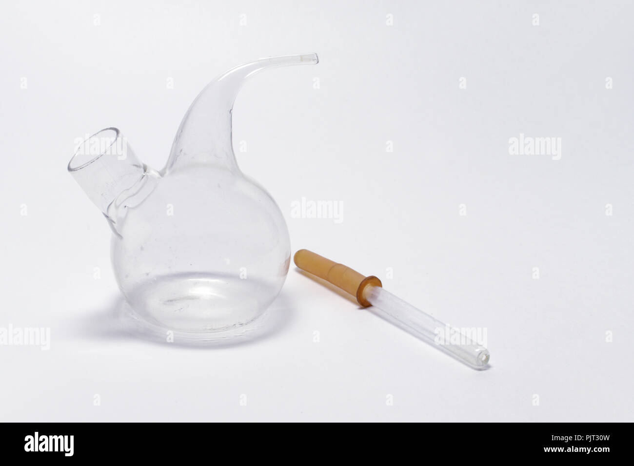 teat pipette with brown rubber tube, laboratory glassware retort with ...