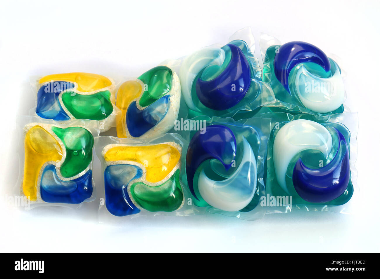 Different detergent pods on white background used for domestic ...