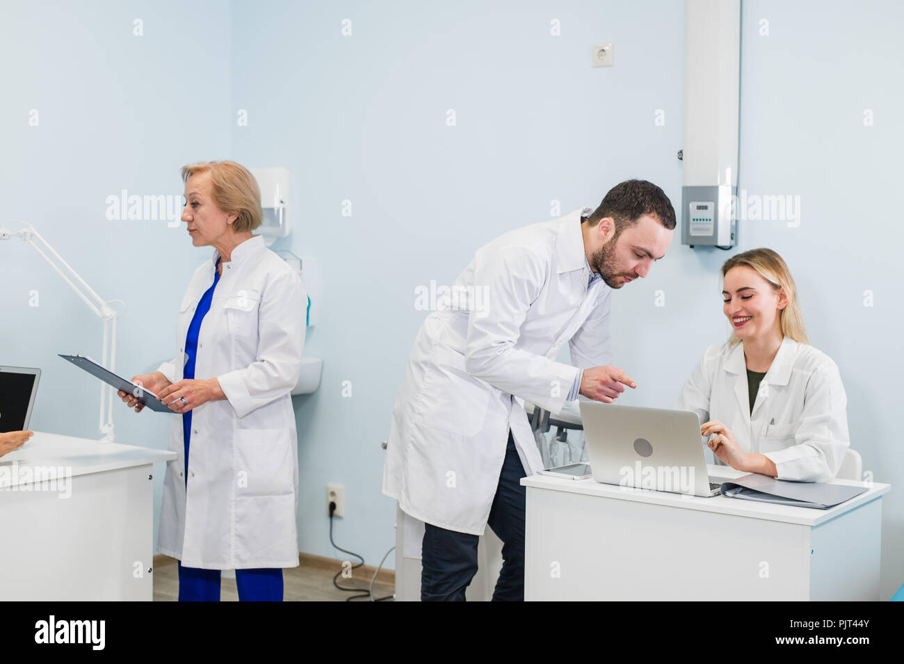 Group of doctors looking in computer hi-res stock photography and ...