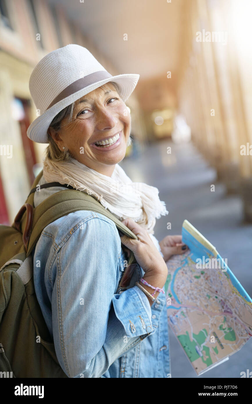 Senior woman traveling in european city, reading map Stock Photo - Alamy