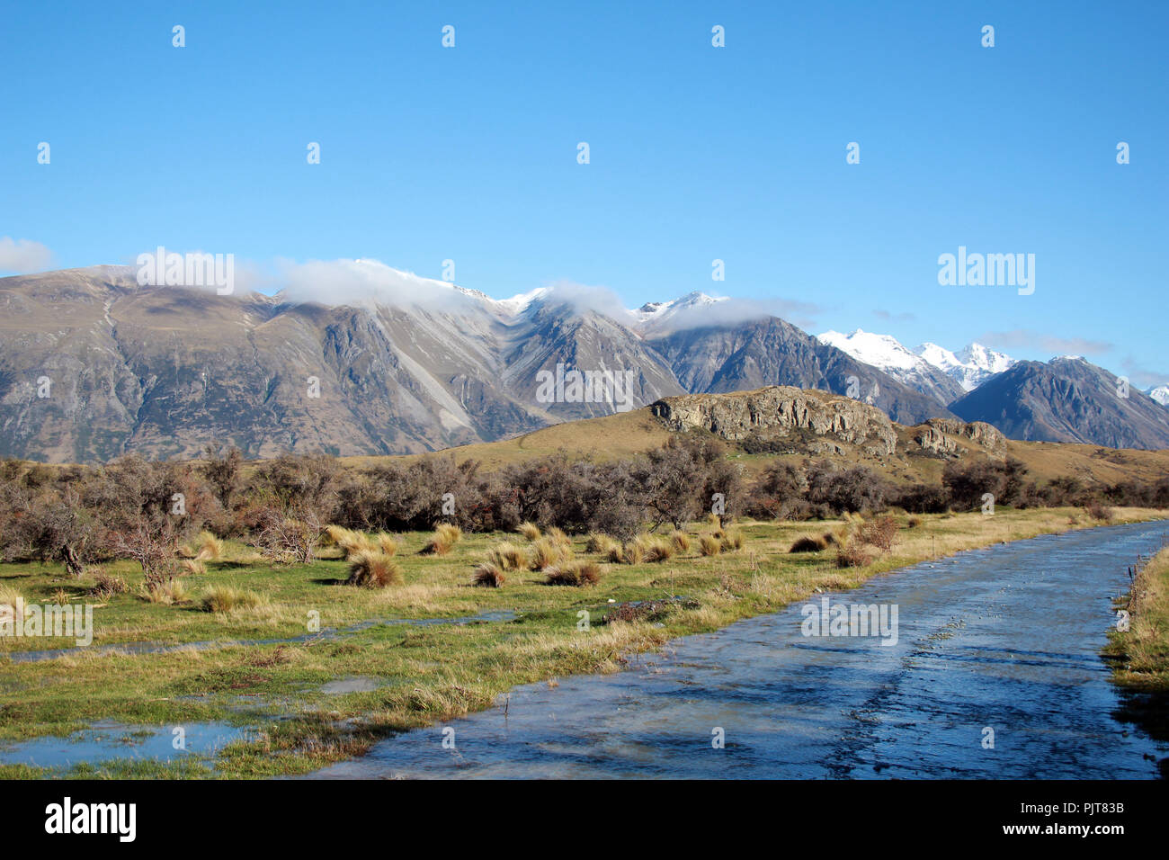 Mount Sunday on a sunny clear day with mountains in the background ...