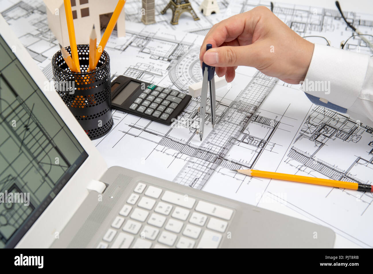 The hand of a male architect drawing a design using a pencil Stock ...