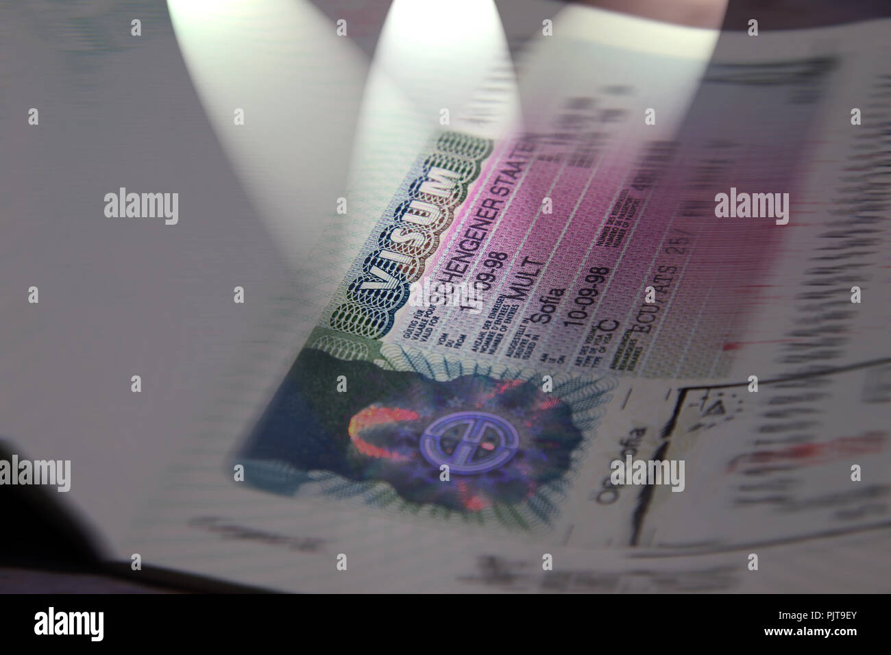 Schengen visa stamp in international passport. Shengen document for ...