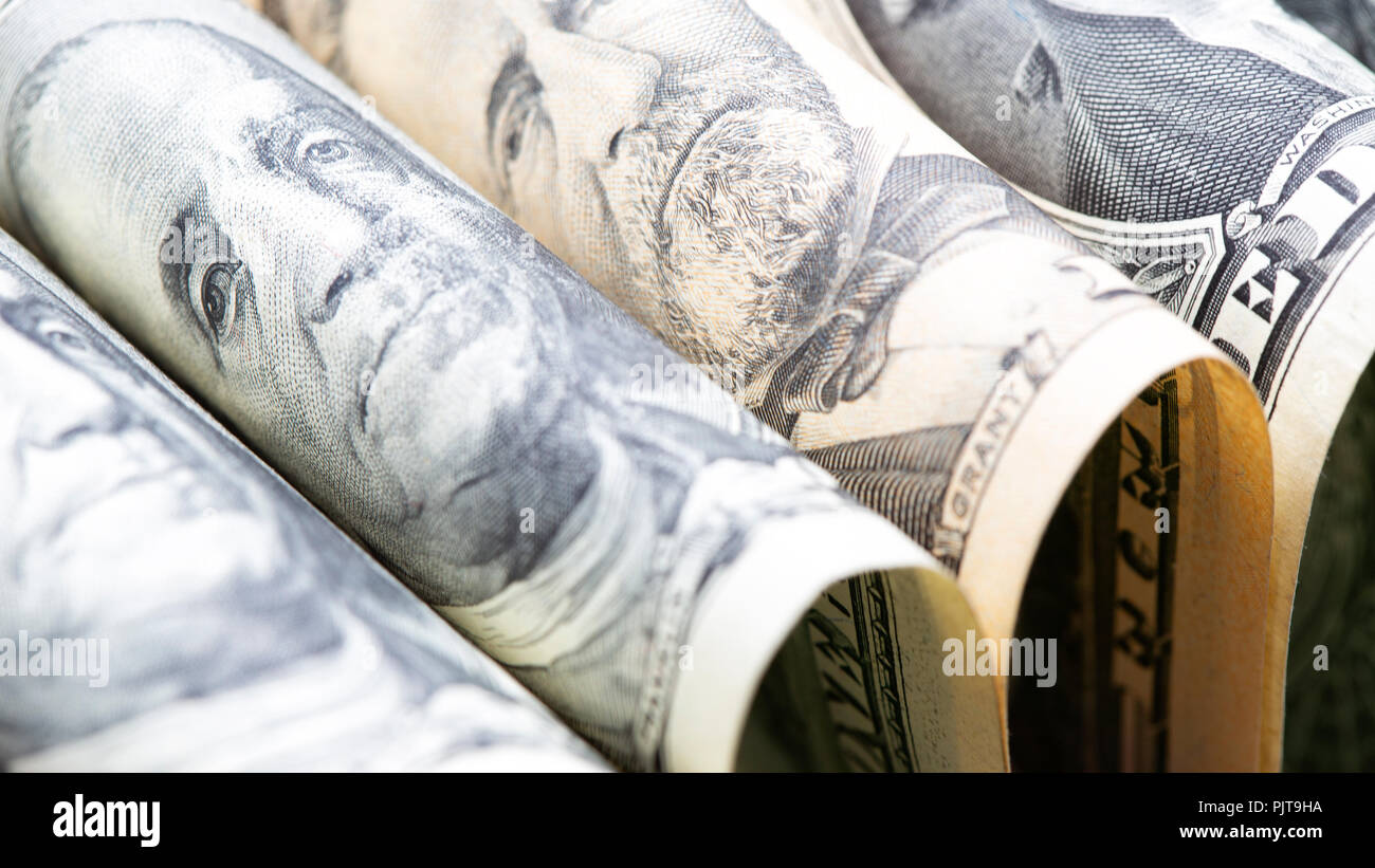 blurred dollars banknote rolled up and close up concept of economy ...