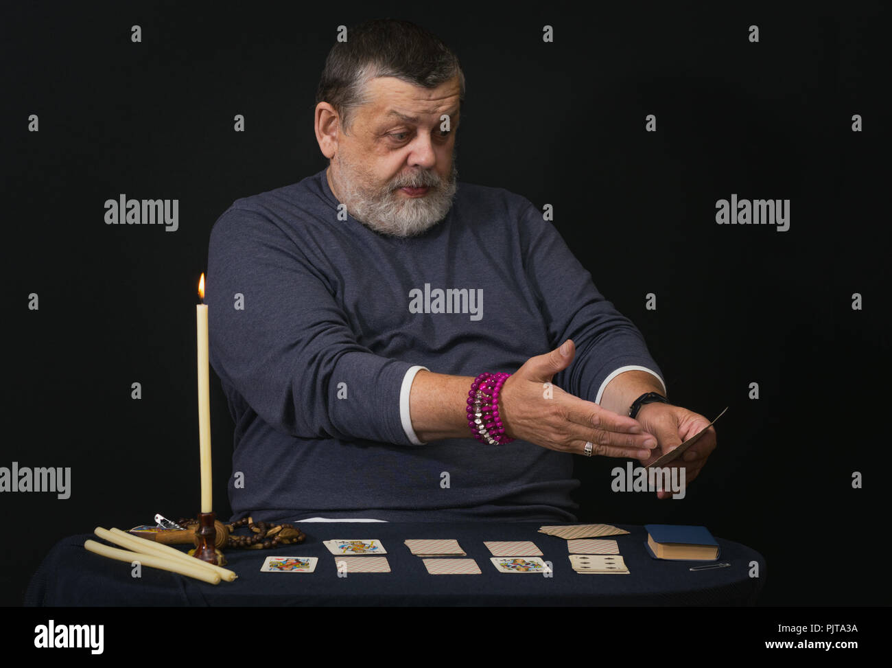 Handsome male fortune teller hi-res stock photography and images - Alamy