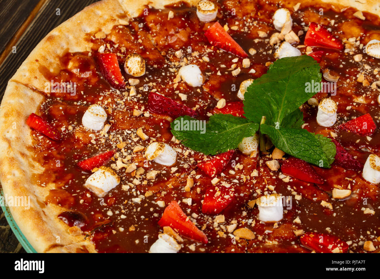 Kids pizza with chocolate served mint leaves Stock Photo - Alamy