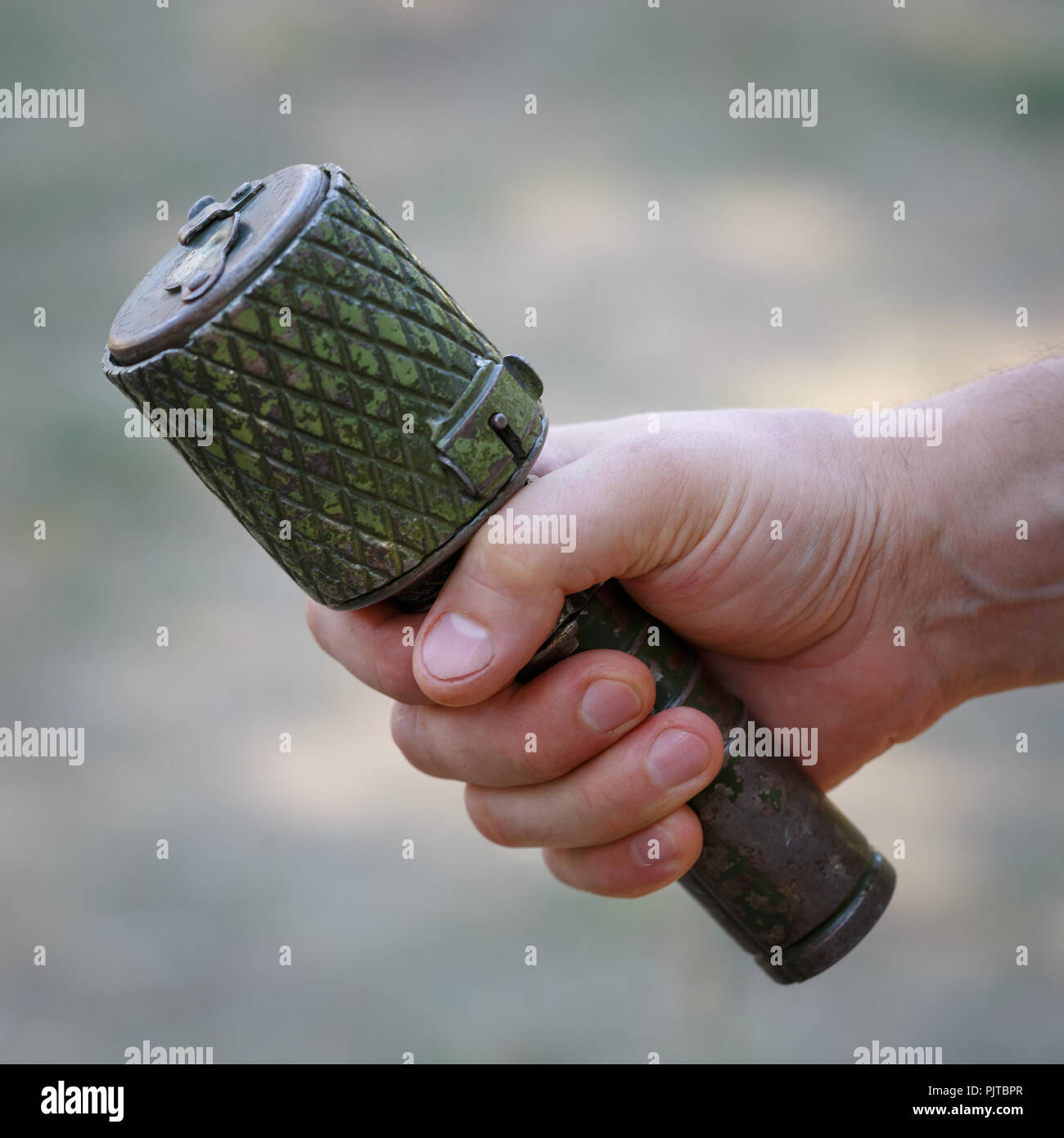Hand grenade in male hi-res stock photography and images - Alamy