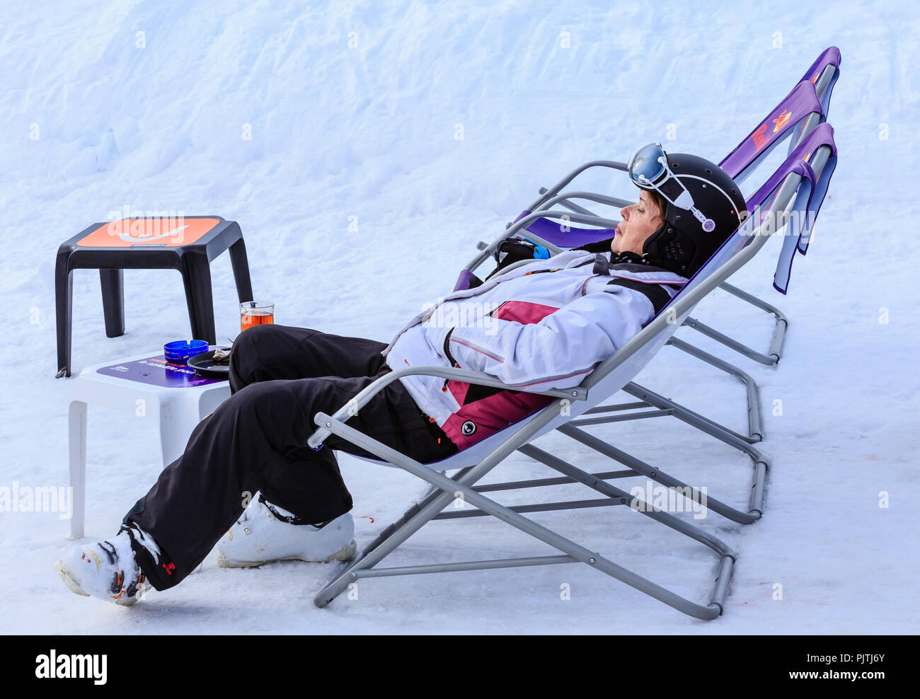 Woman resting on chair hi-res stock photography and images - Alamy
