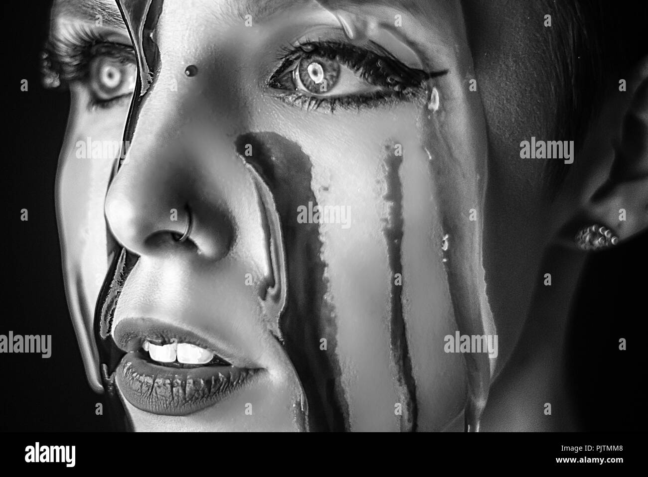 Studio portrait of a young woman's face covered in slime Stock Photo ...