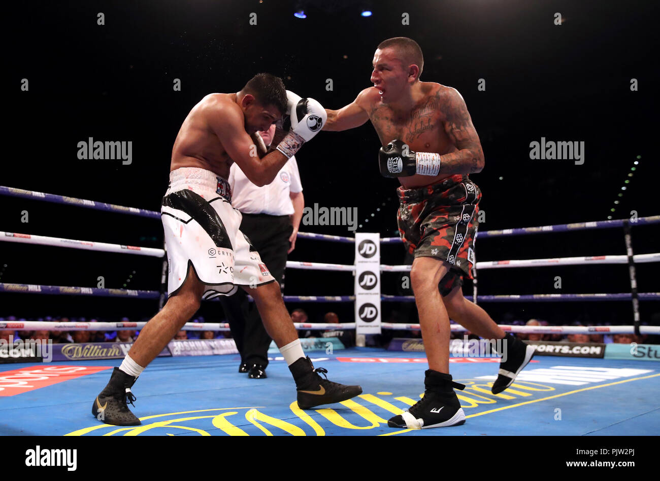 Amir Khan (left) and Samuel Vargas in action during their Welterweight ...
