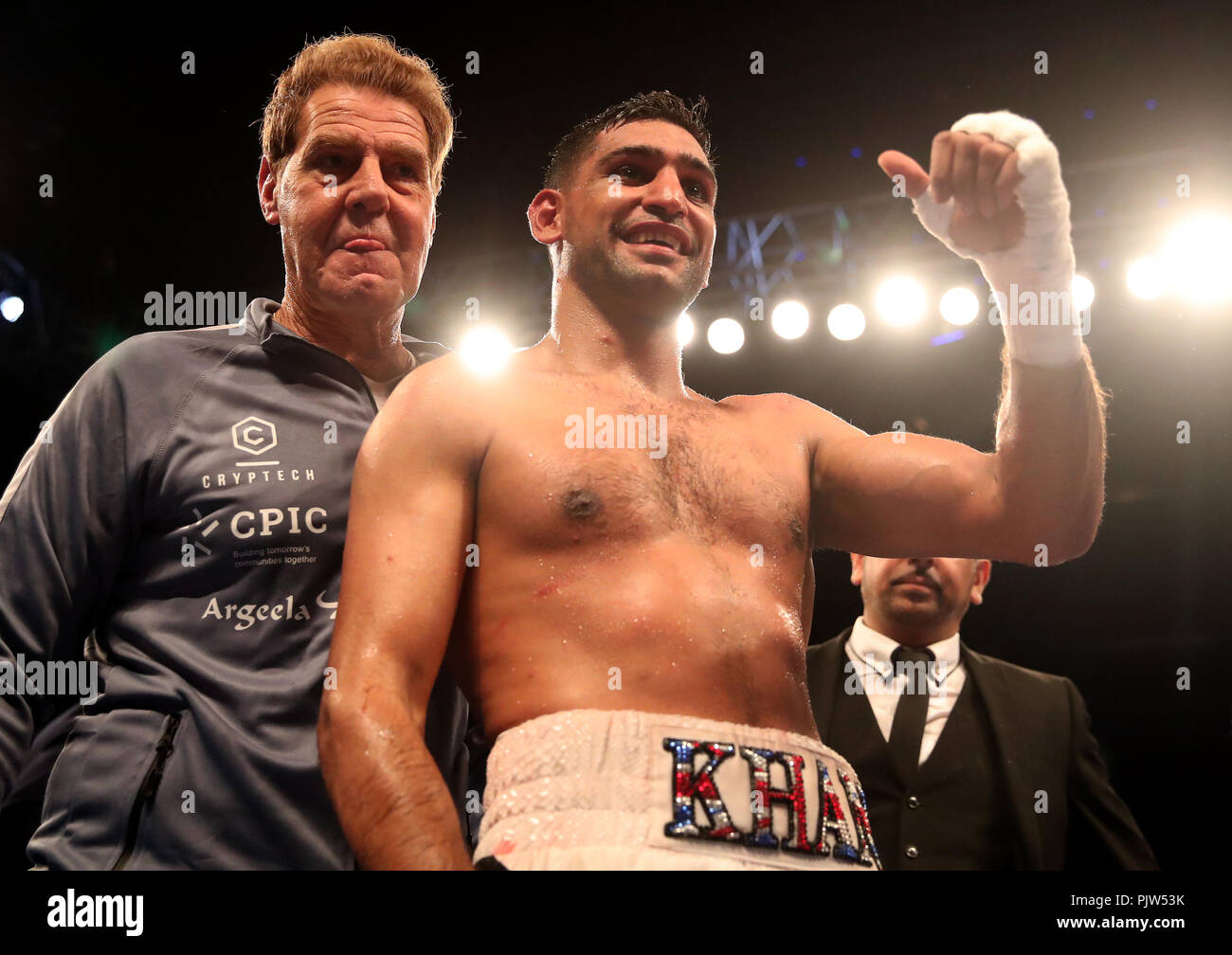 Amir Khan celebrates with trainer Joe Goossen after beating Samuel ...