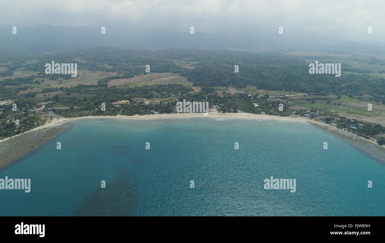 Beautiful tropical beach Cabugao with white sand and palm trees in the ...
